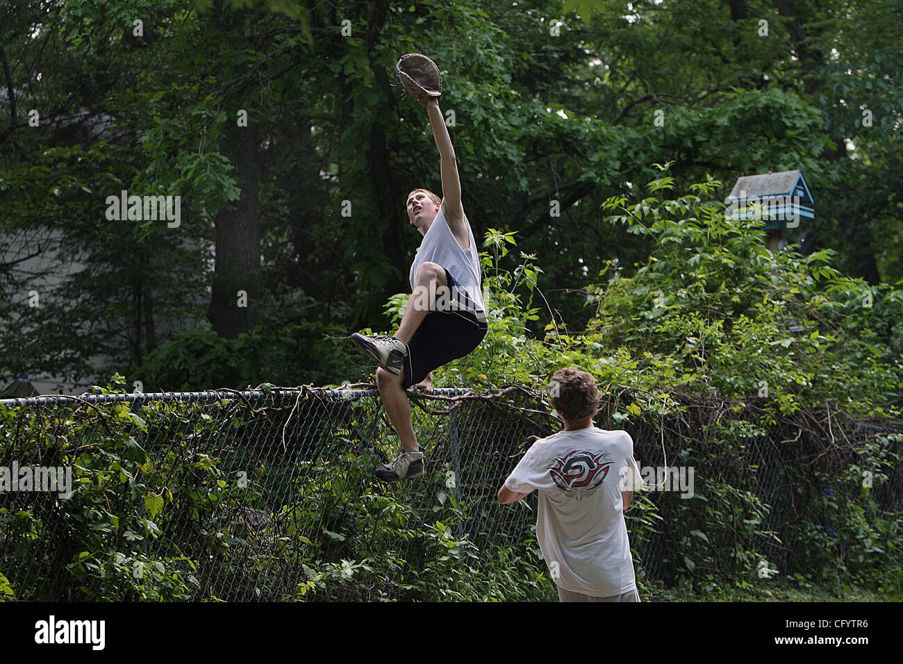 Ball over fence hi-res stock photography and images - Alamy