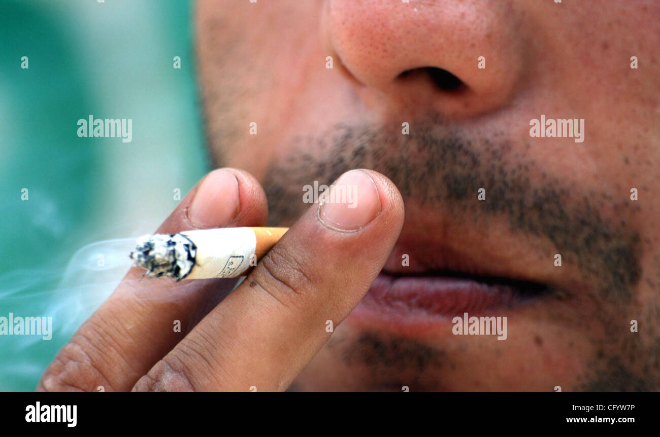 A Kashmiri smokes a cigratte in kashmir india. Smoking in world has ...