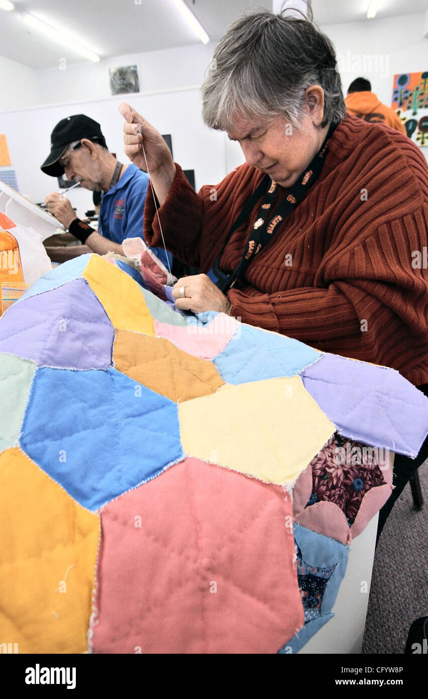Student Patricia Rogers works on a hexagon quilt at The Arc art center ...