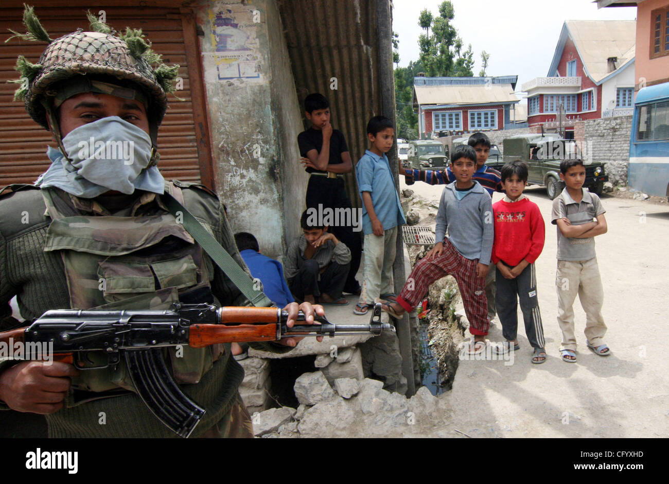 Indian army soldier keeps guard during an encounter in Woyan, 22 Km (13 ...