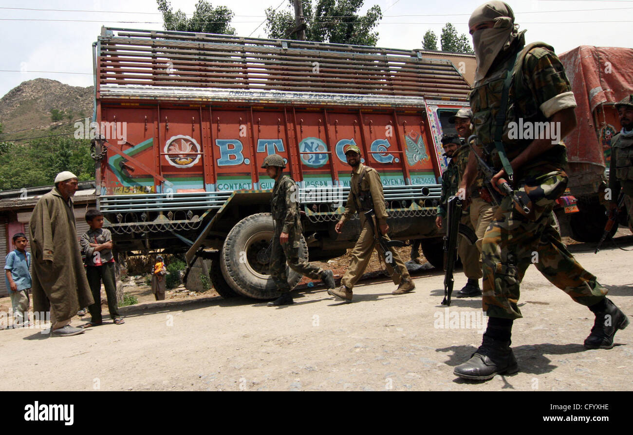 Indian army soldier walk near the site of gunbattle in Woyan, 22 Km (13 ...