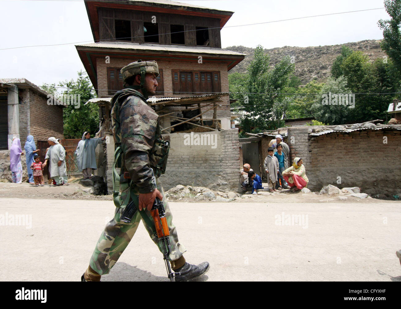 Indian army soldier walk near the site of gunbattle in Woyan, 22 Km (13 ...