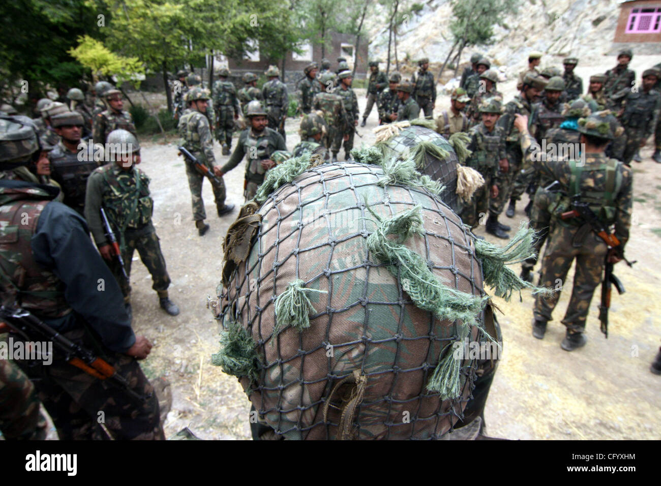 A Group of indian soldiers assemble after a gun battle in Woyan, 22 Km ...