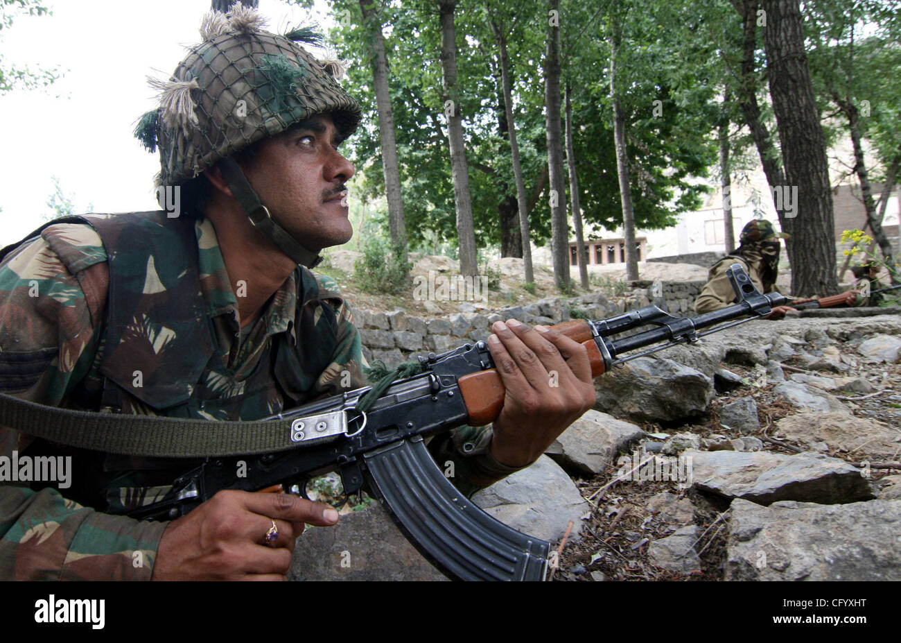 Indian army soldiers takes their position during an encounter in Woyan ...