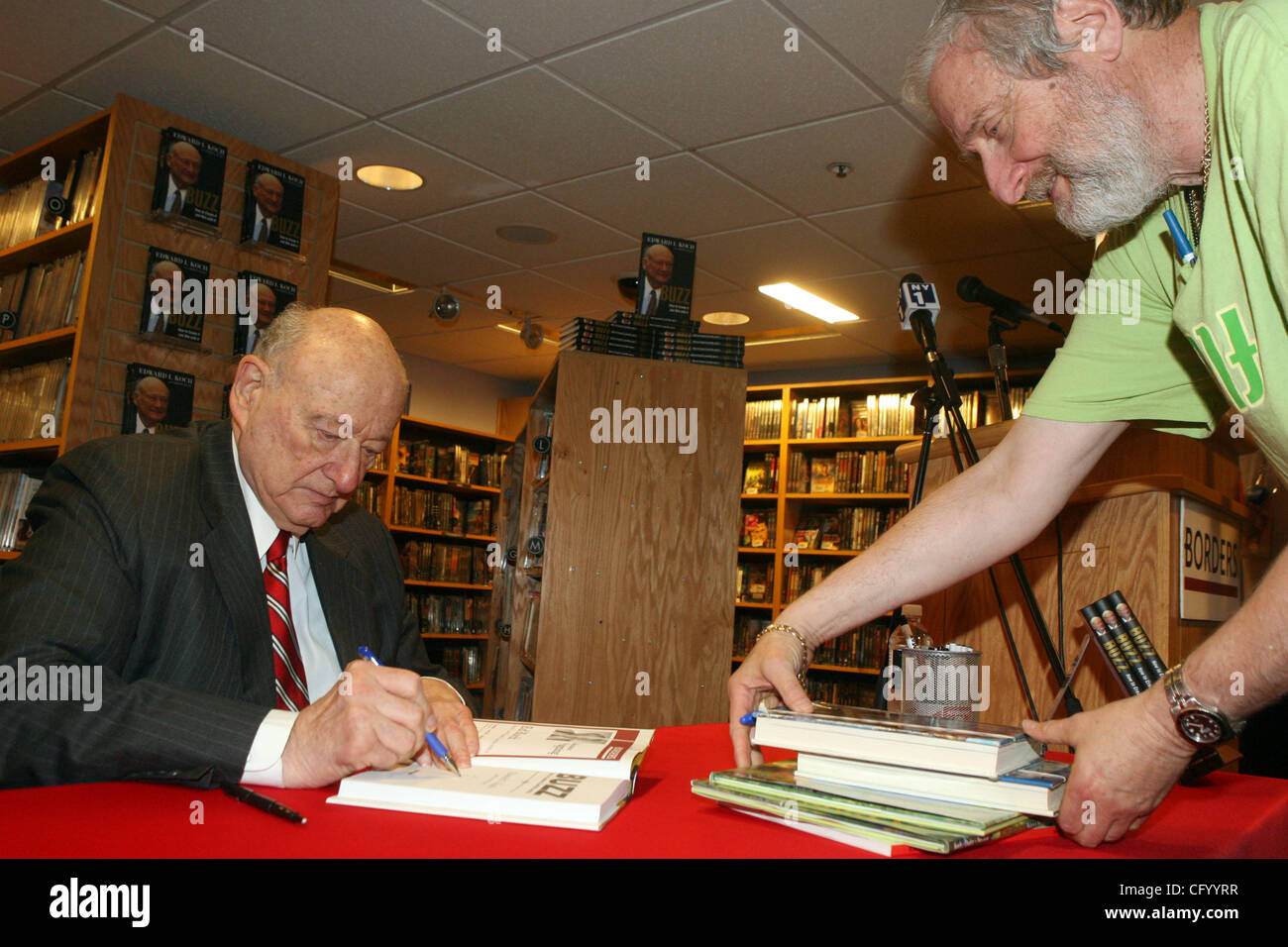Former NYC Mayor Edward Koch singing his new book "Buzz" at Borders ...