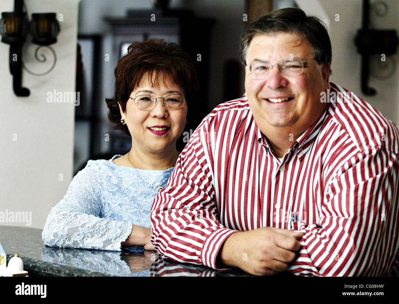 Noriko Wolfe and her husband Dennis Wolfe (LtoR) at their home in ...