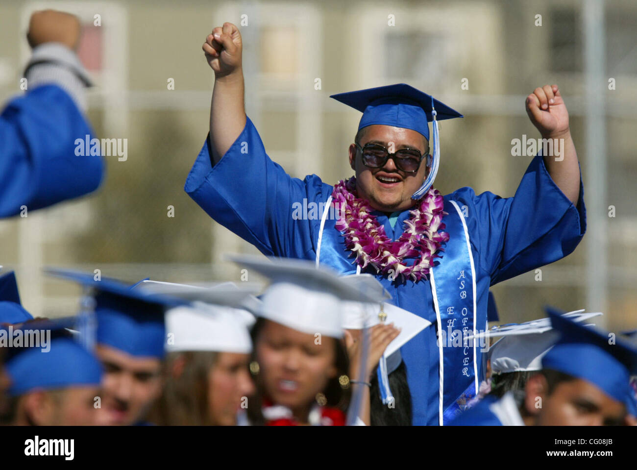 Encinal High School senior Jacob Ryan Manibusan cheers on his fellow ...