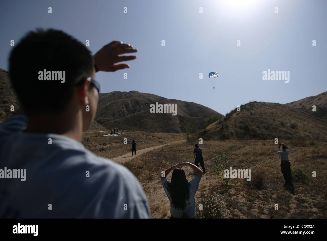 Photo by: Guy Kitchens Del Rosa Hotshots watch as smokejumpers ...