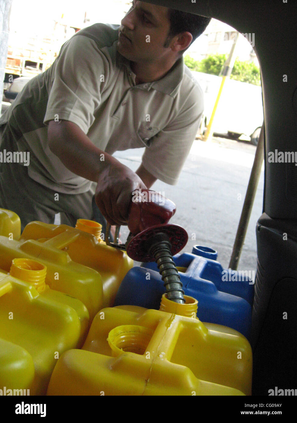 Jun 17, 2007 - Gaza City, Gaza Strip - A Palestinian man fills jerry ...
