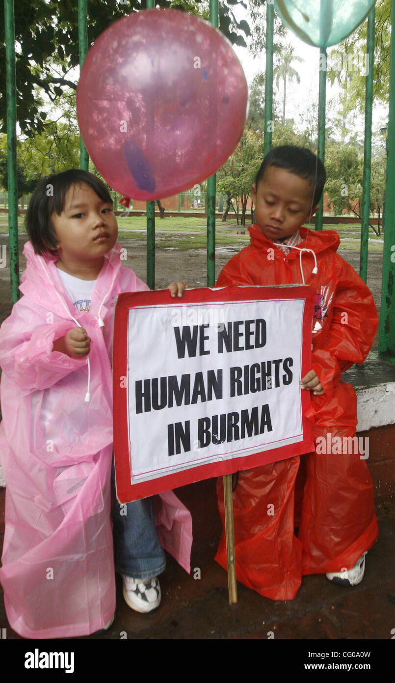 Burmese children hold placards at a protest to oppose the detention of ...