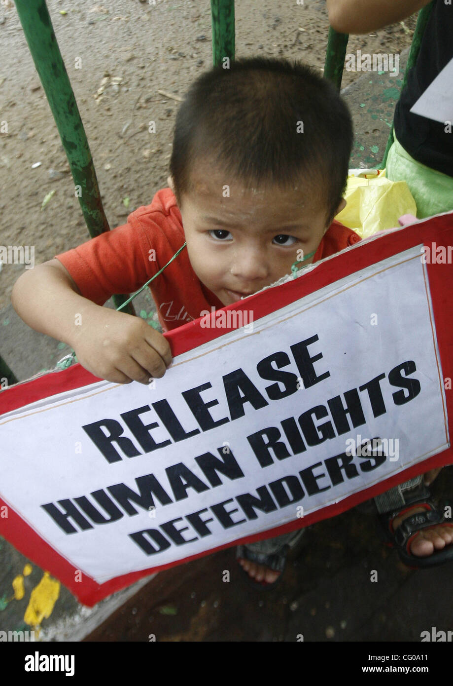 Burmese children hold placards at a protest to oppose the detention of ...