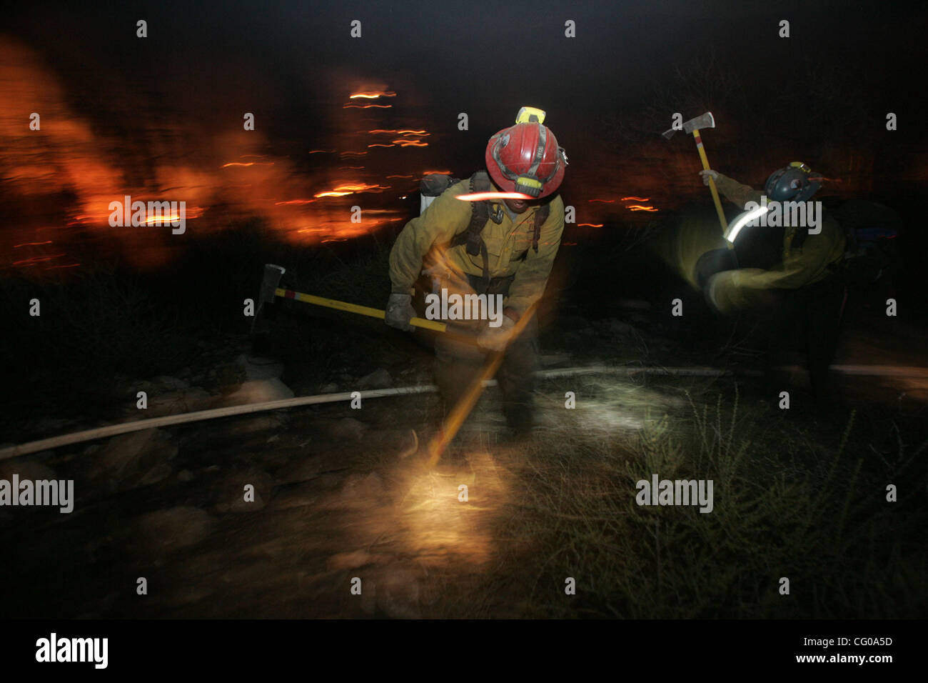 Photo by: Guy Kitchens Del Rosa Hotshots cut line during a fire in Big ...