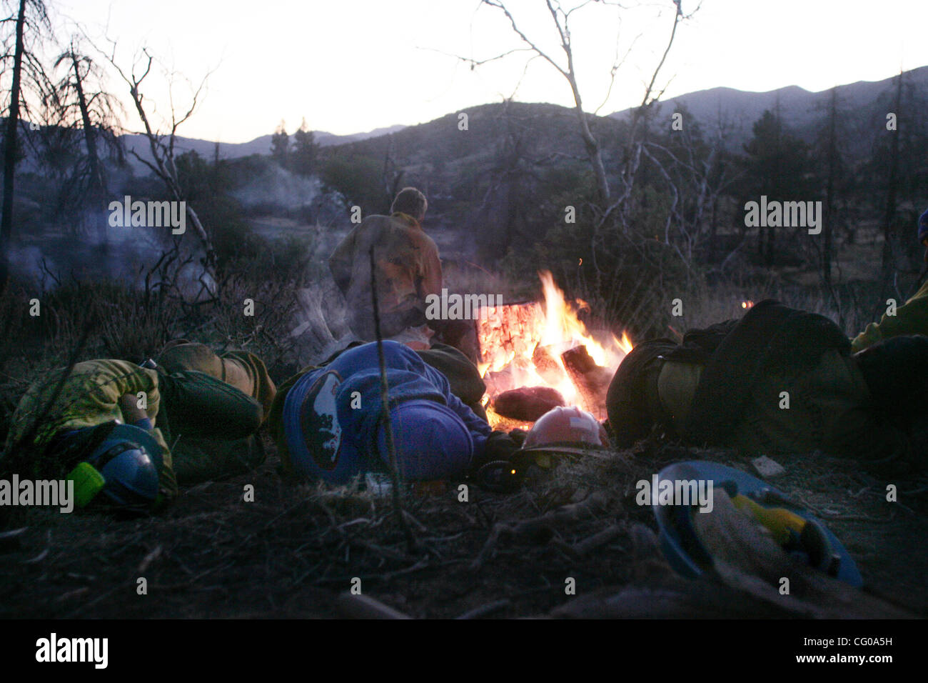 Photo by: Guy Kitchens Del Rosa Hotshot Paul Avila sits while other ...
