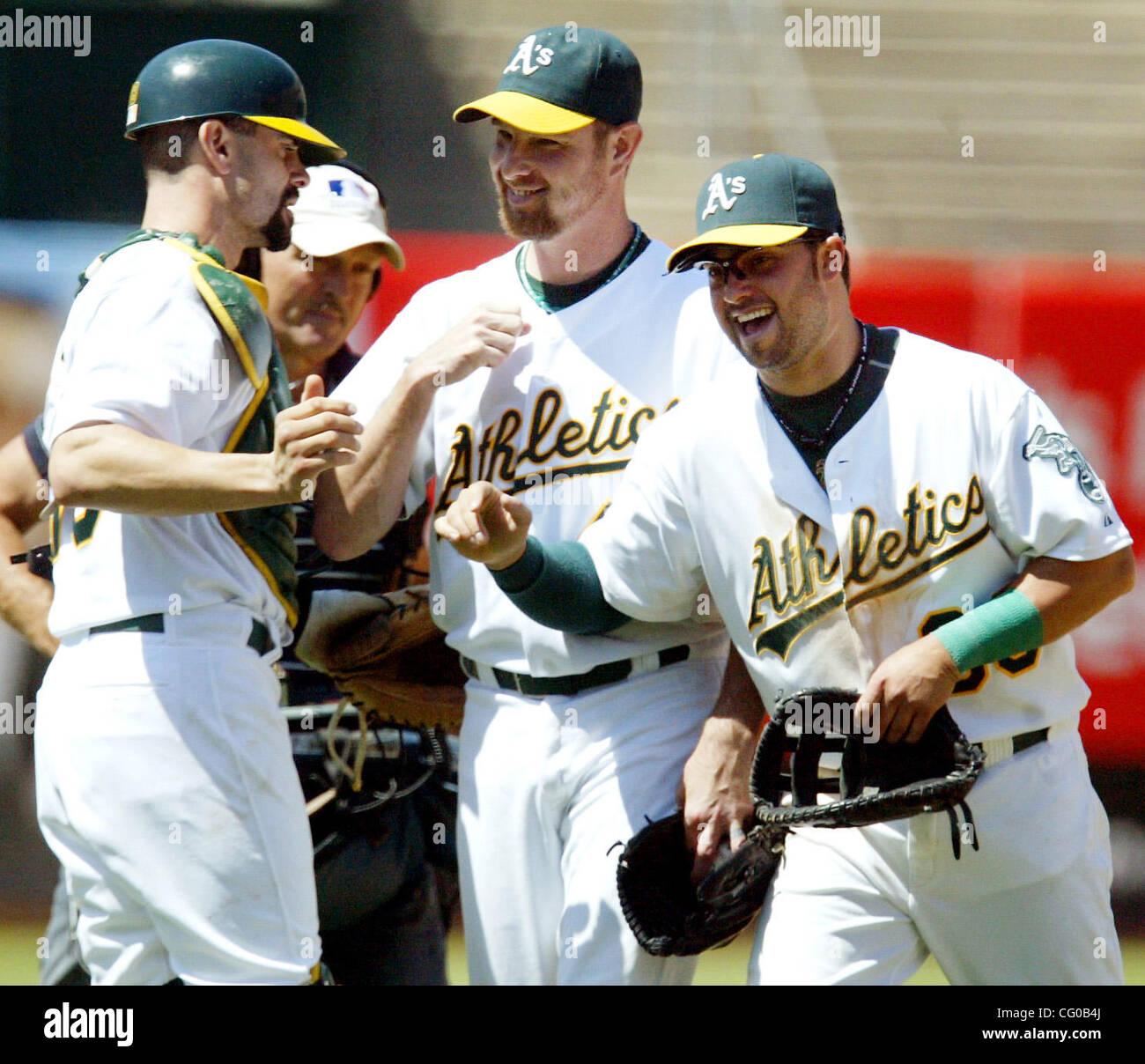 A's Jason Kendall, Alan Embree and Nick Swisher celebrate after beating ...