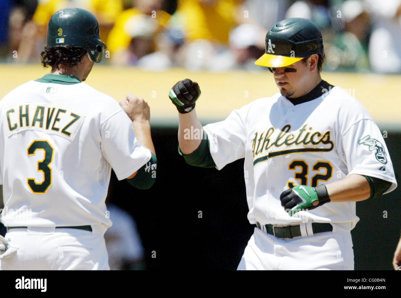 A's Eric Chavez congratulates Jack Cust at the plate on a two run ...