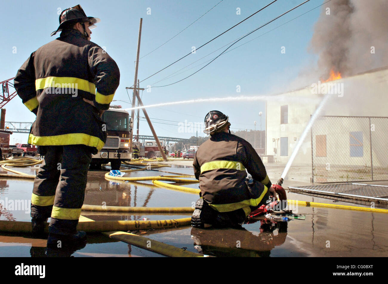San Francisco Fire Department crews pump water into a warehouse fire ...