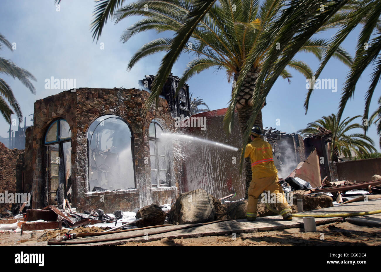 June 24, 2007, Del Mar, Ca.USA. Firefighter DENNIS COWAN put out the ...