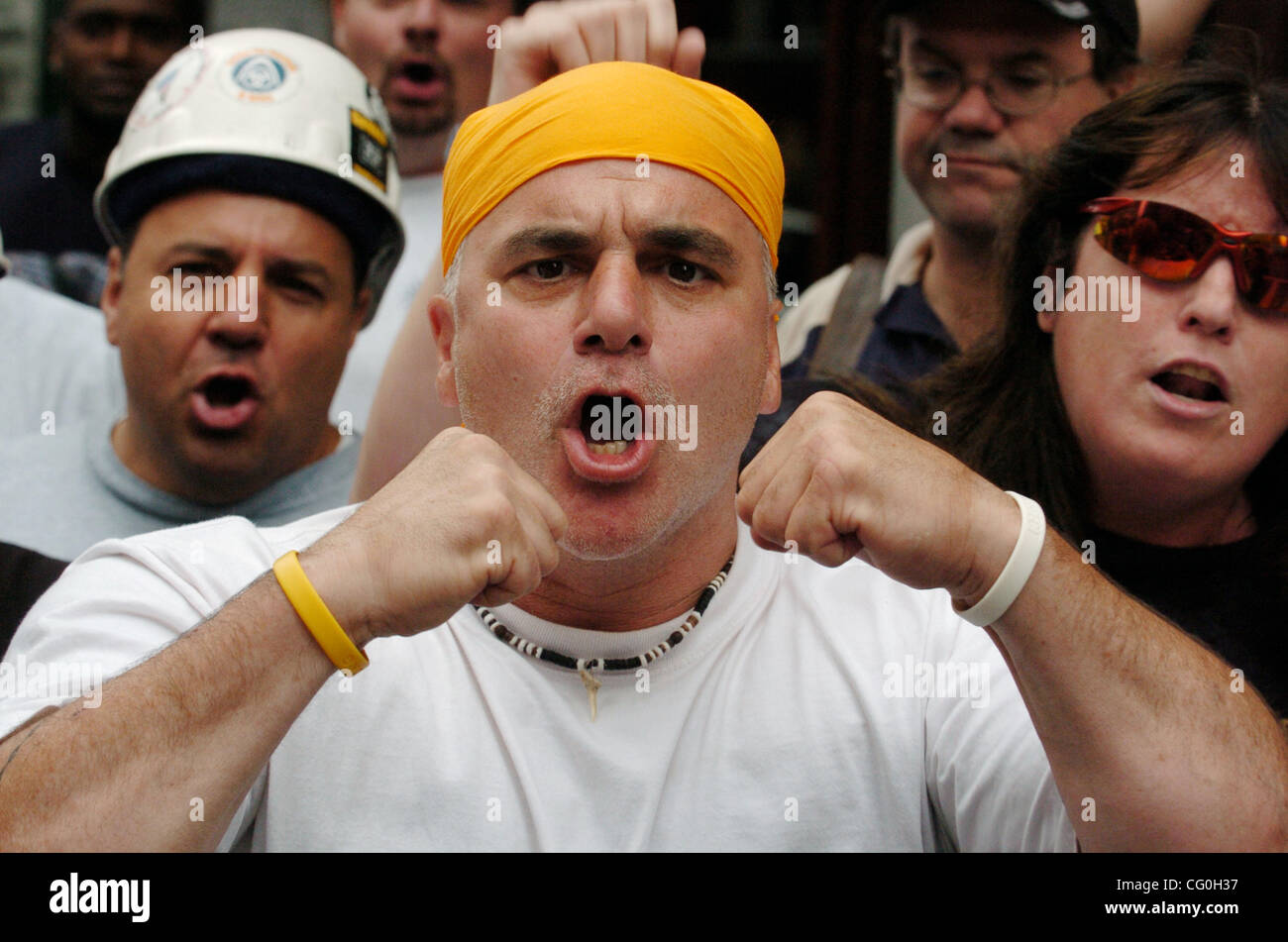 Daniel Fernandez, of Brooklyn and a member of Local 79 chants as ...