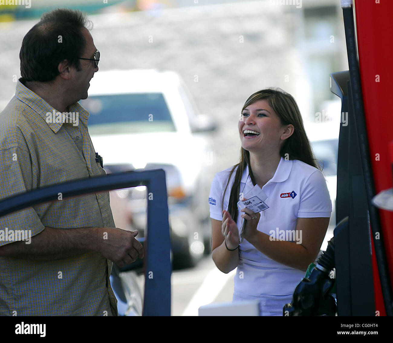 Karen Holtz (right), of Interstate Oil Co., reacts after customer Eric ...