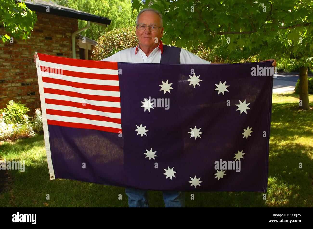 David Davis, from Alamo, holds a replica of the Easton Flag at his home ...