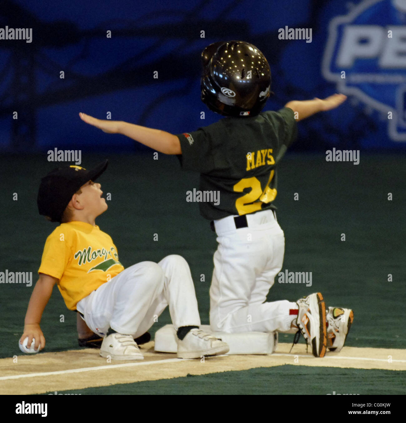 (l to r) Matt Blocker watches as Chad Mays, both of Morgan Hill teams ...