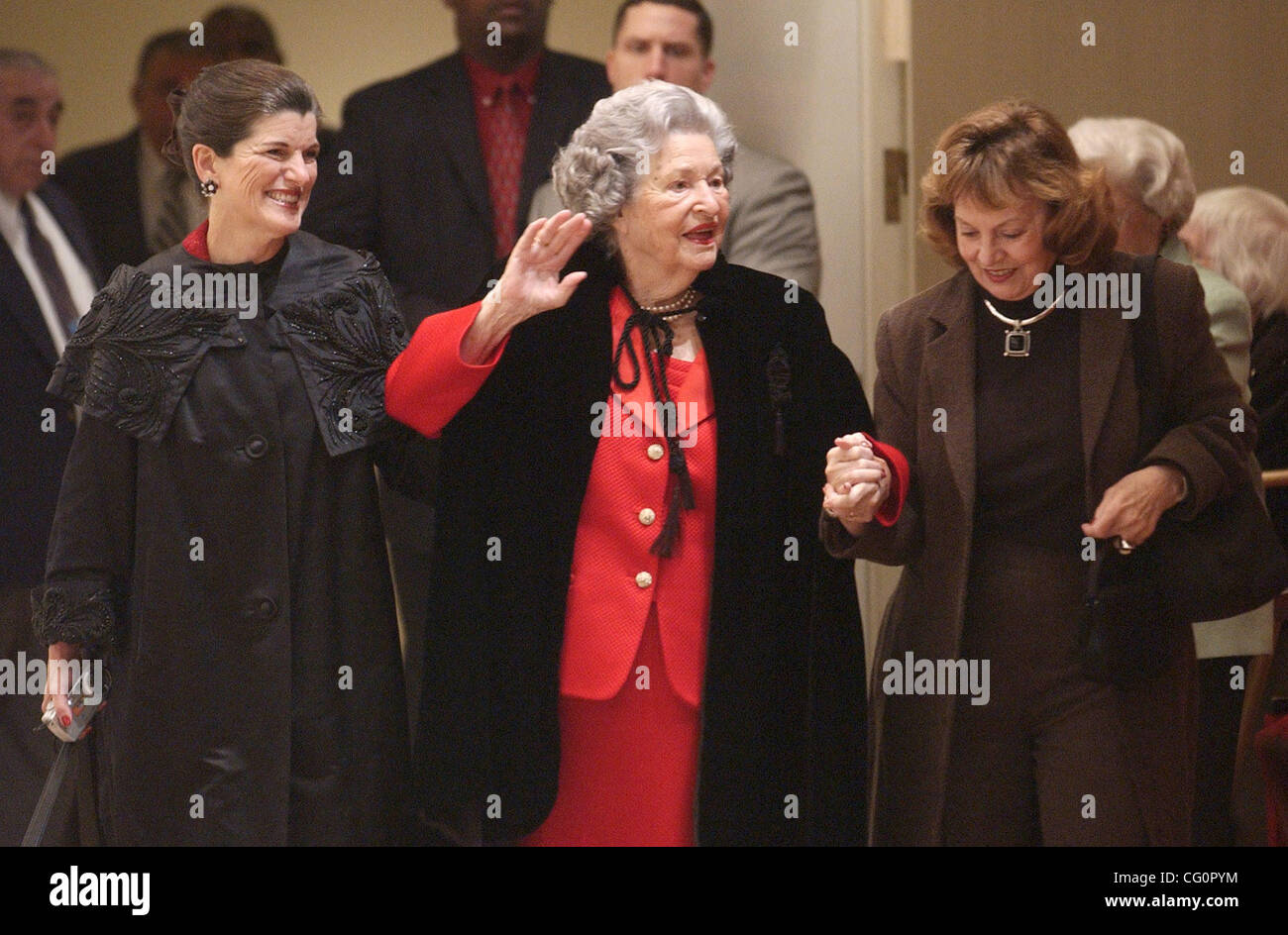 METRO --- Lady Bird Johnson, center, waves to the audience Wednesday ...