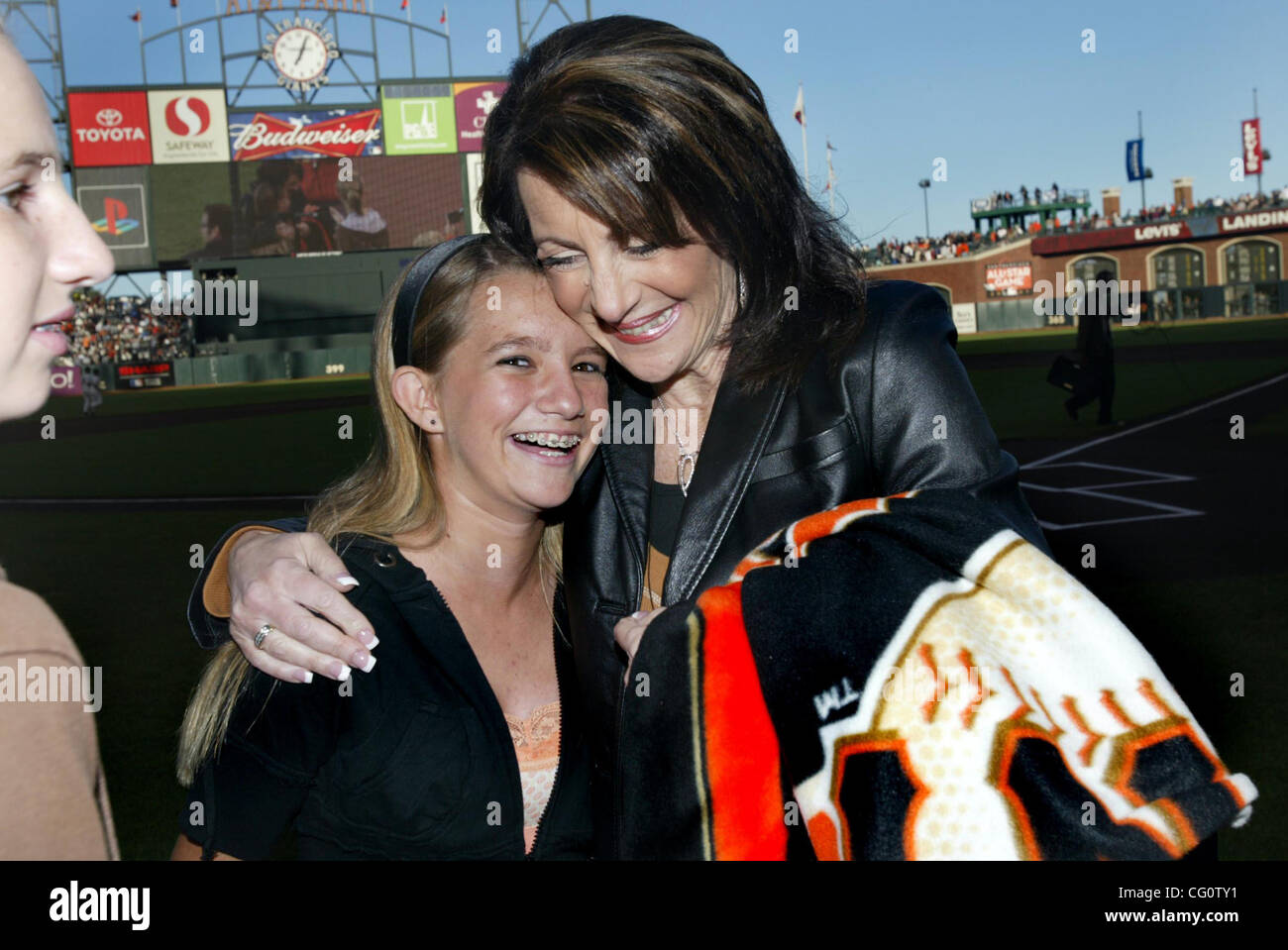 Sarah Lessard, 12, center, of Vallejo gets a hugh from her voice ...