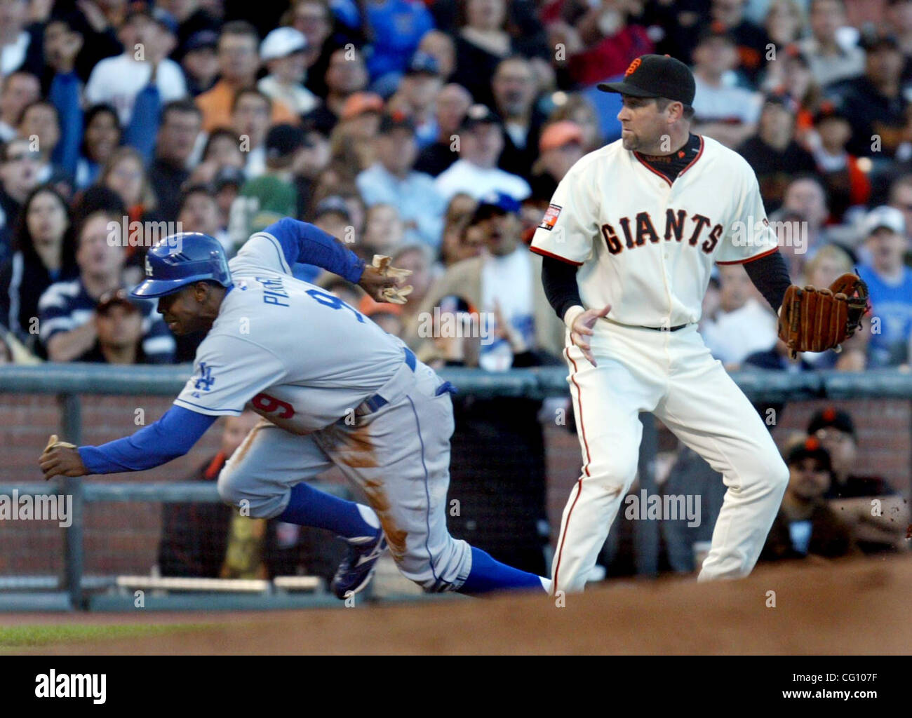 Los Angeles Dodgers' Juan Pierre, left, runs to home after stealing ...