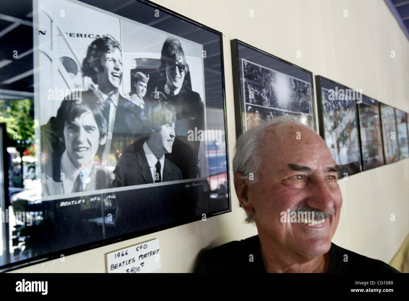 Photojournalist Fred Pardini stands next to his Beattles photo exhibit ...