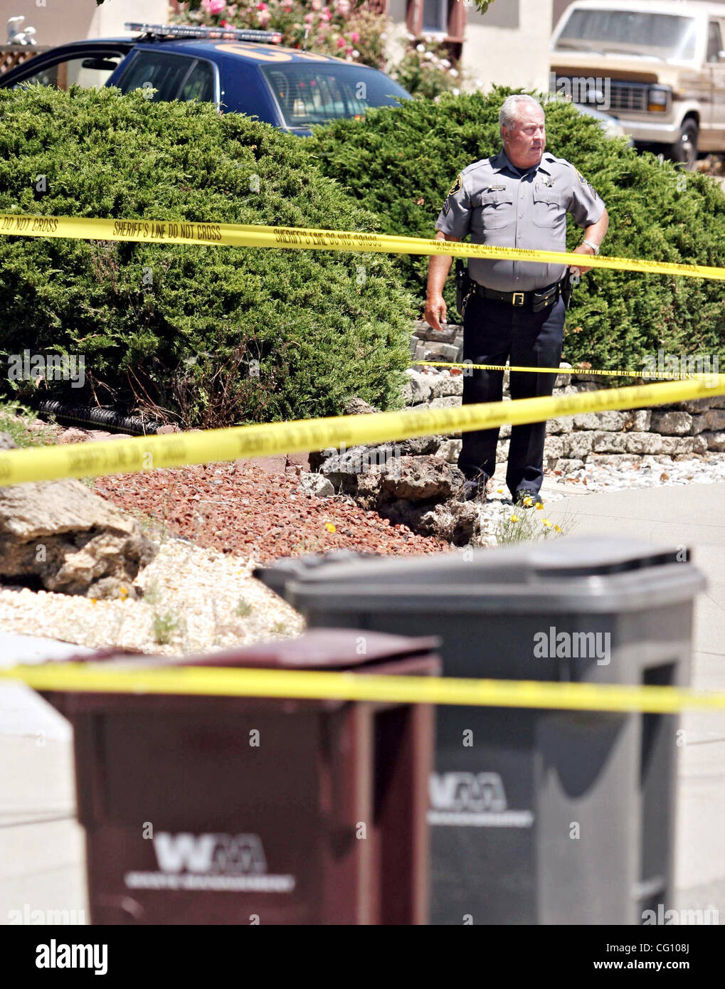 An Alameda County Sheriff's Deputy investigates the scene of a Waste ...