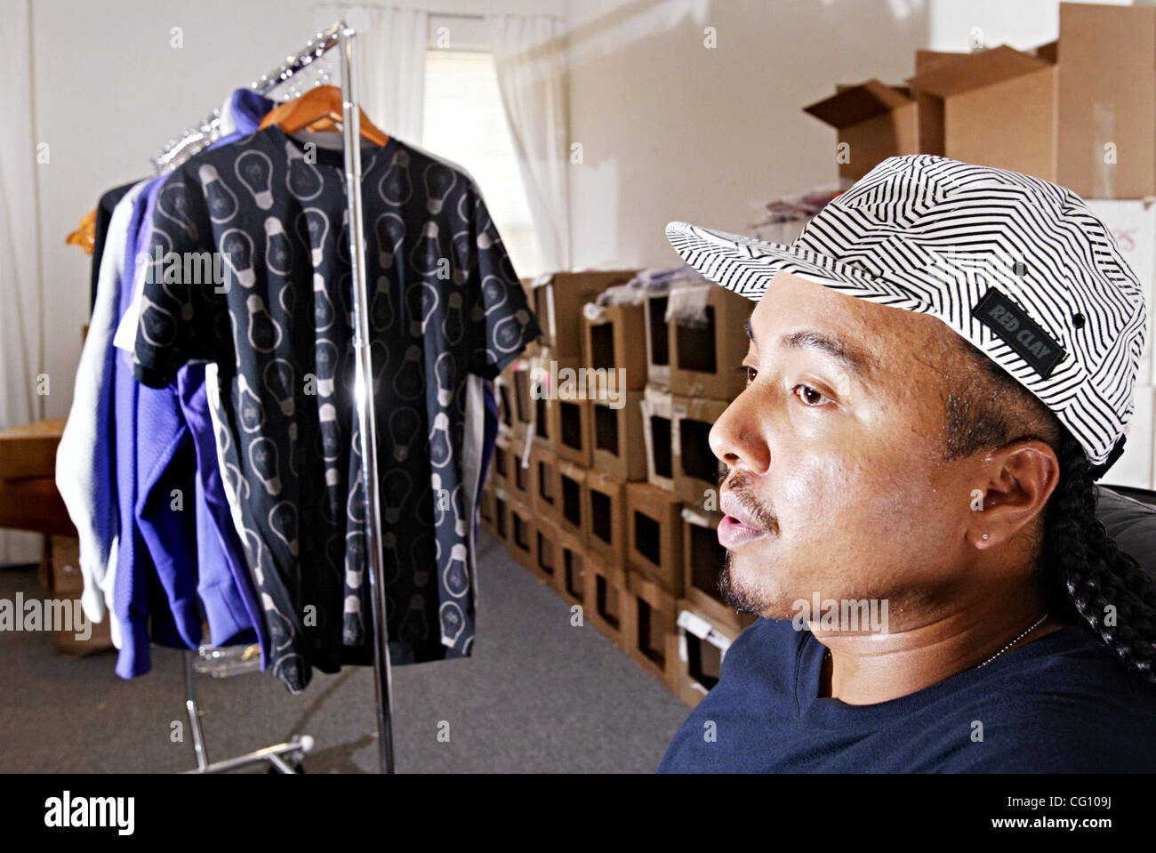 Adamu Chan talks about his clothing designs at the headquarters in ...