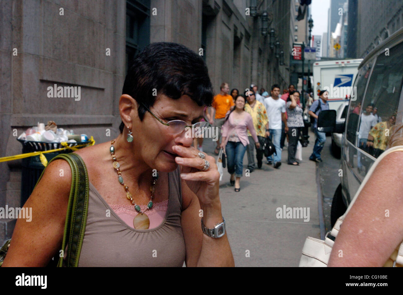 A woman holds her nose along 45th St. following yesterday's steam pipe ...