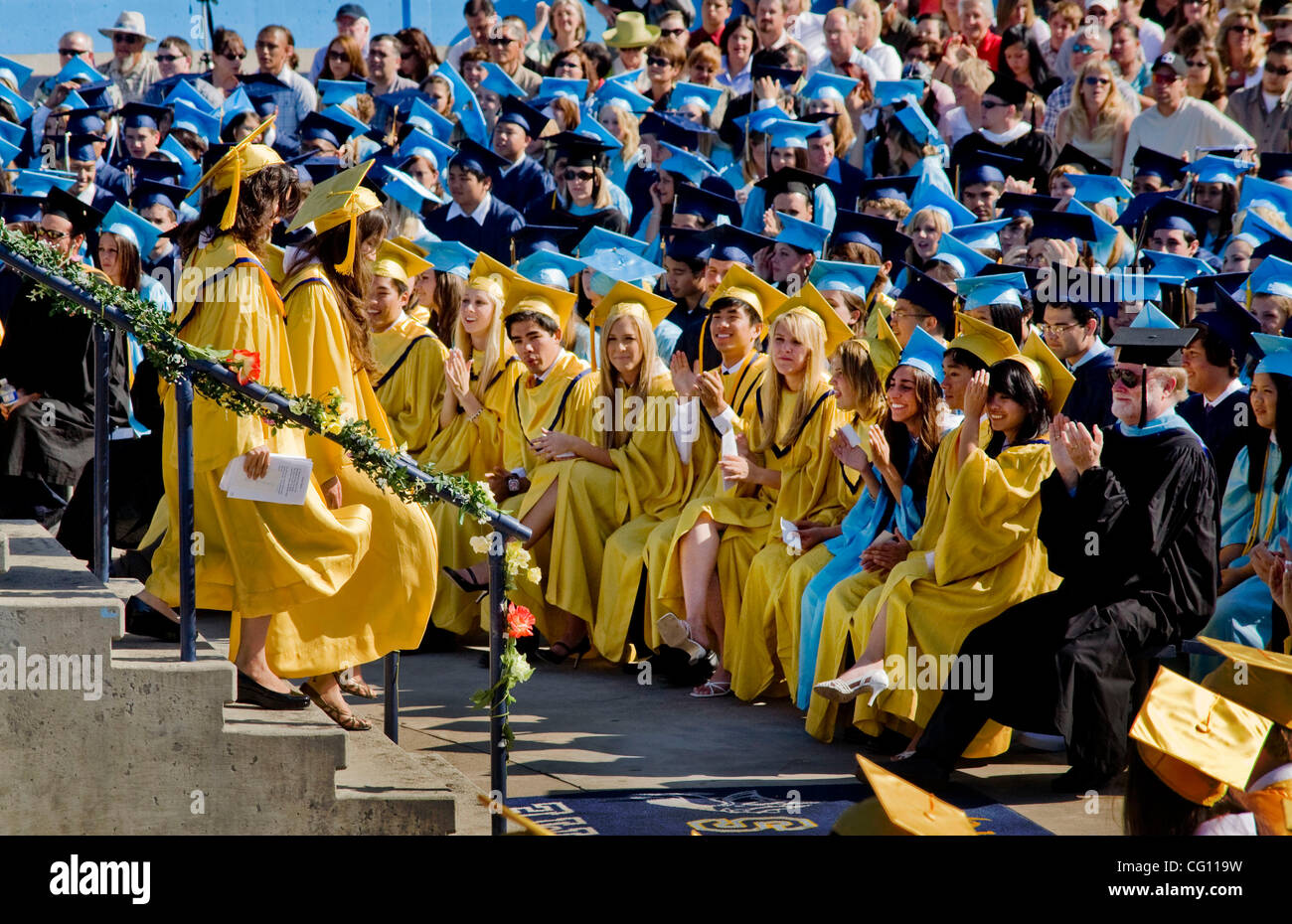 Wearing caps and gowns, two high school senior class co-valedictorians ...