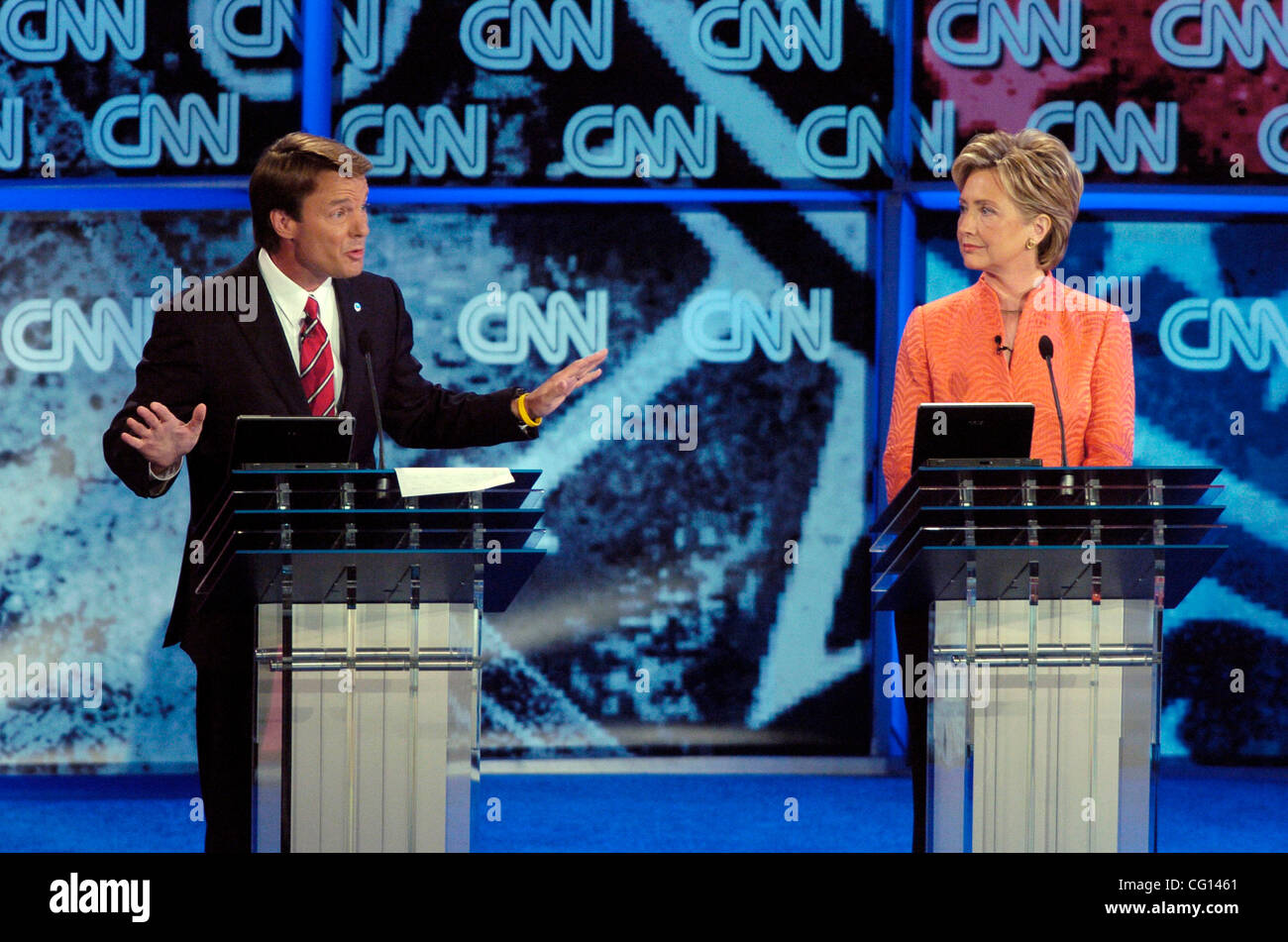 John Edwards, left, gestures to Sen. Hillary Clinton during the CNN ...