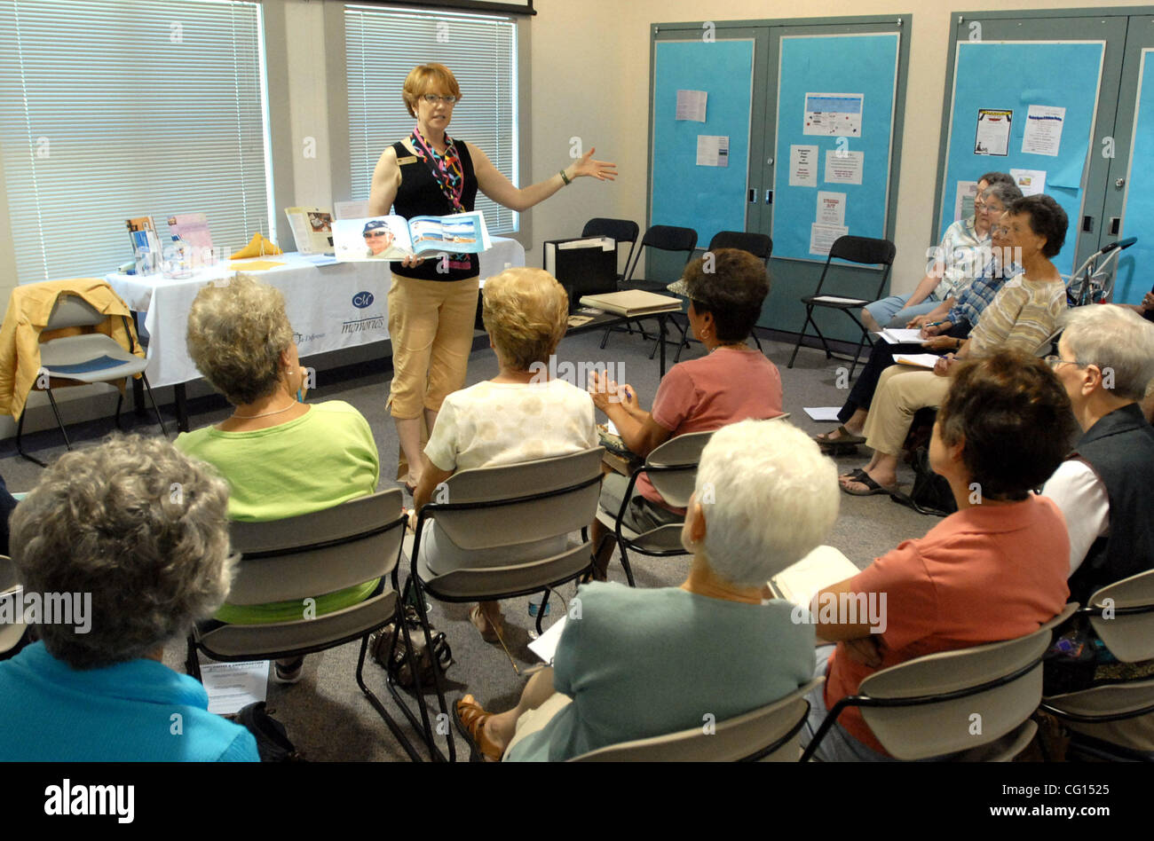 FREESTANDING--Instructor Carole MacLean shows off a bound book she ...