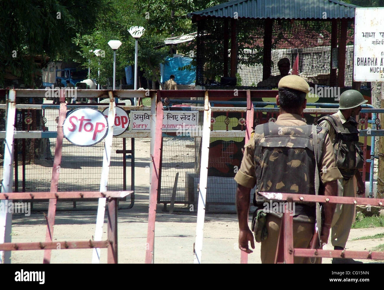 Indian paramilitary soldiers place barricades at the entrance of their ...