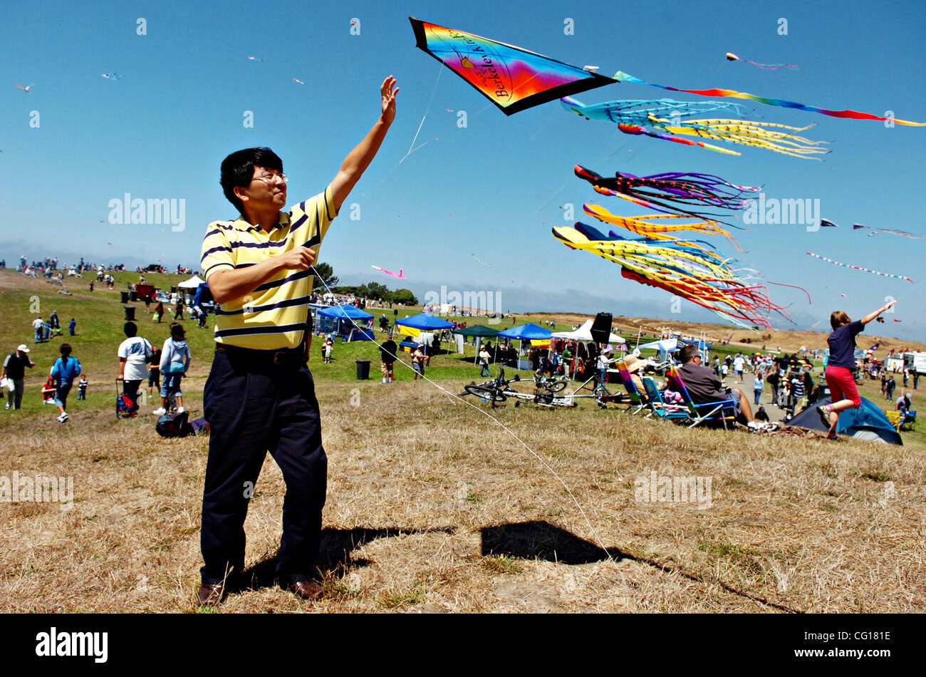 Simon Bae of San Jose launches a kite during the Berkeley Kite Festival ...