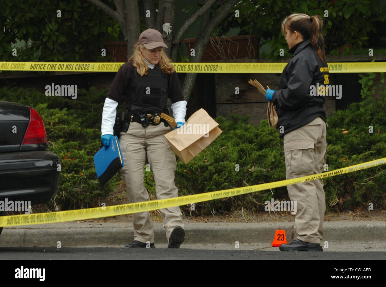 Contra Costa County Sheriff's Department police survey the scene where ...