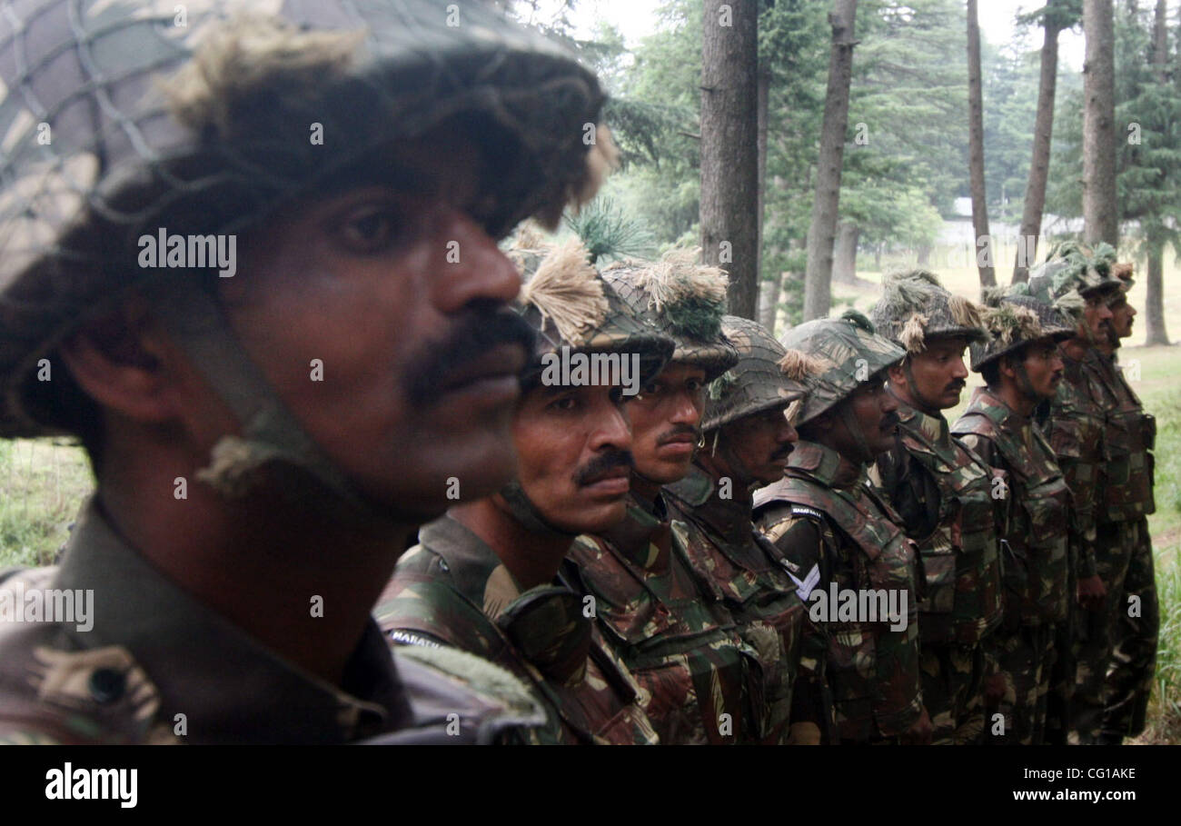 Indian army soldiers stand in lines after end of a encounter in Uri ...