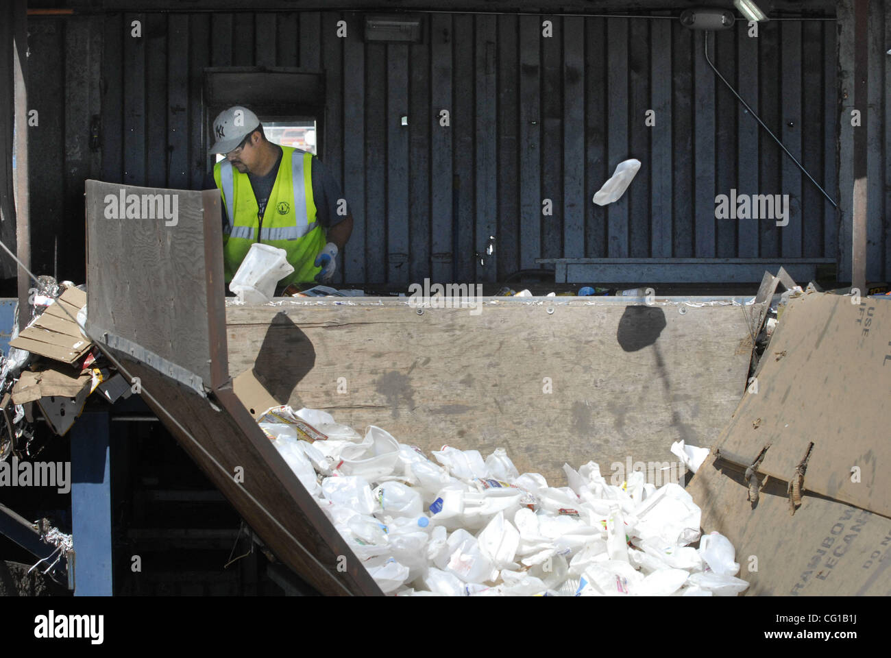 Gerardo Rubio, sorts plastic jugs being recycled at Pacific Rim ...