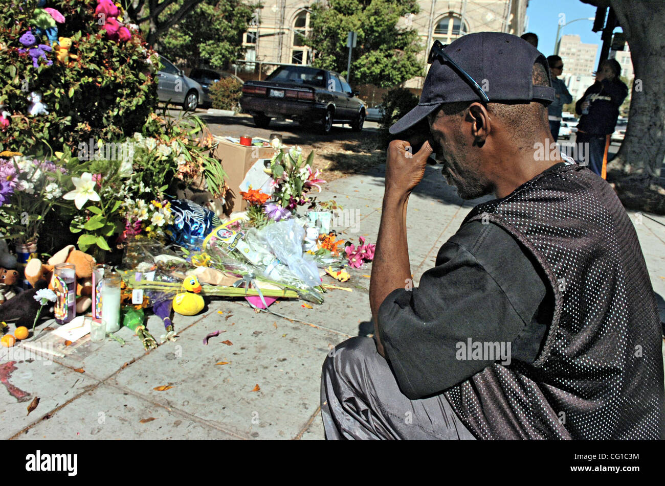 Detrick Moore of Oakland looks over a memorial for Chauncey Bailey ...