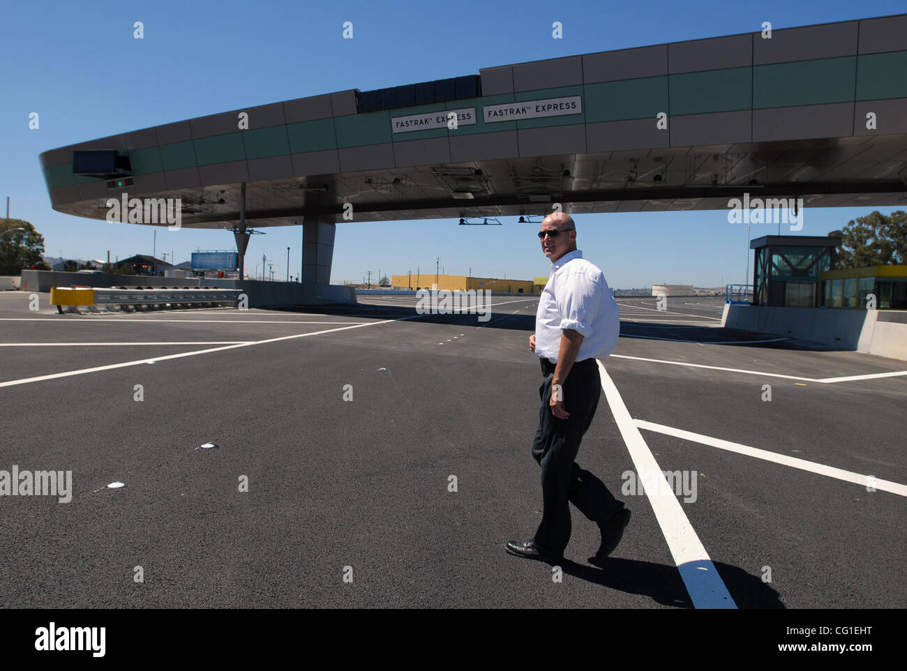 Caltrans spokesperson Keith Wayne walks across the Fastrak Express ...