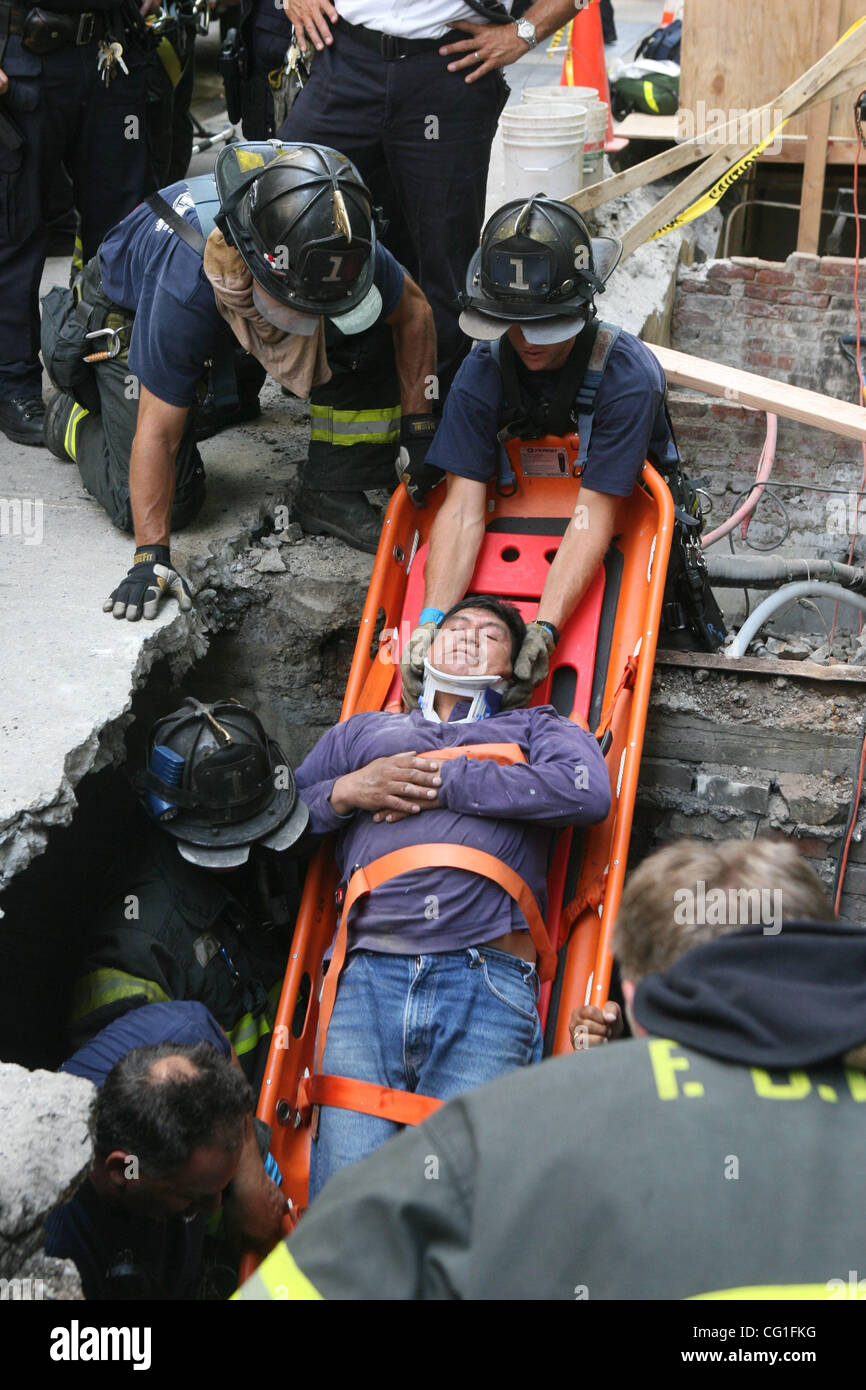 Firefighters rescue construction worker hi-res stock photography and ...