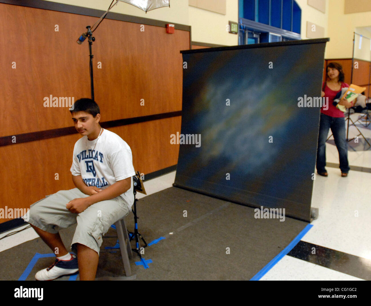 Incoming sophomore Shan Harris has his school portrait taken as his ...