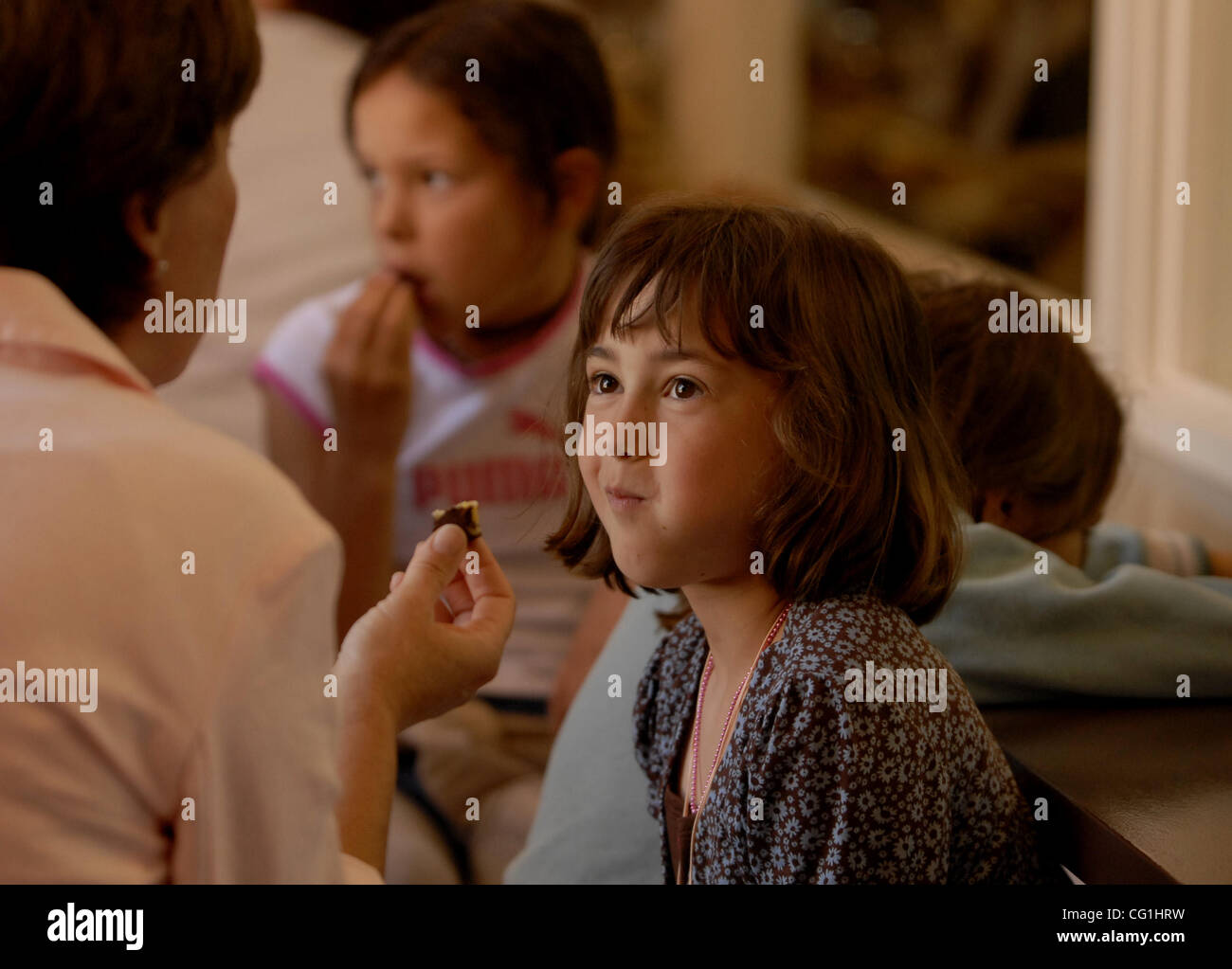 Gabi Franco, 6, of Alameda enjoys a bite of a chocolate creation with ...