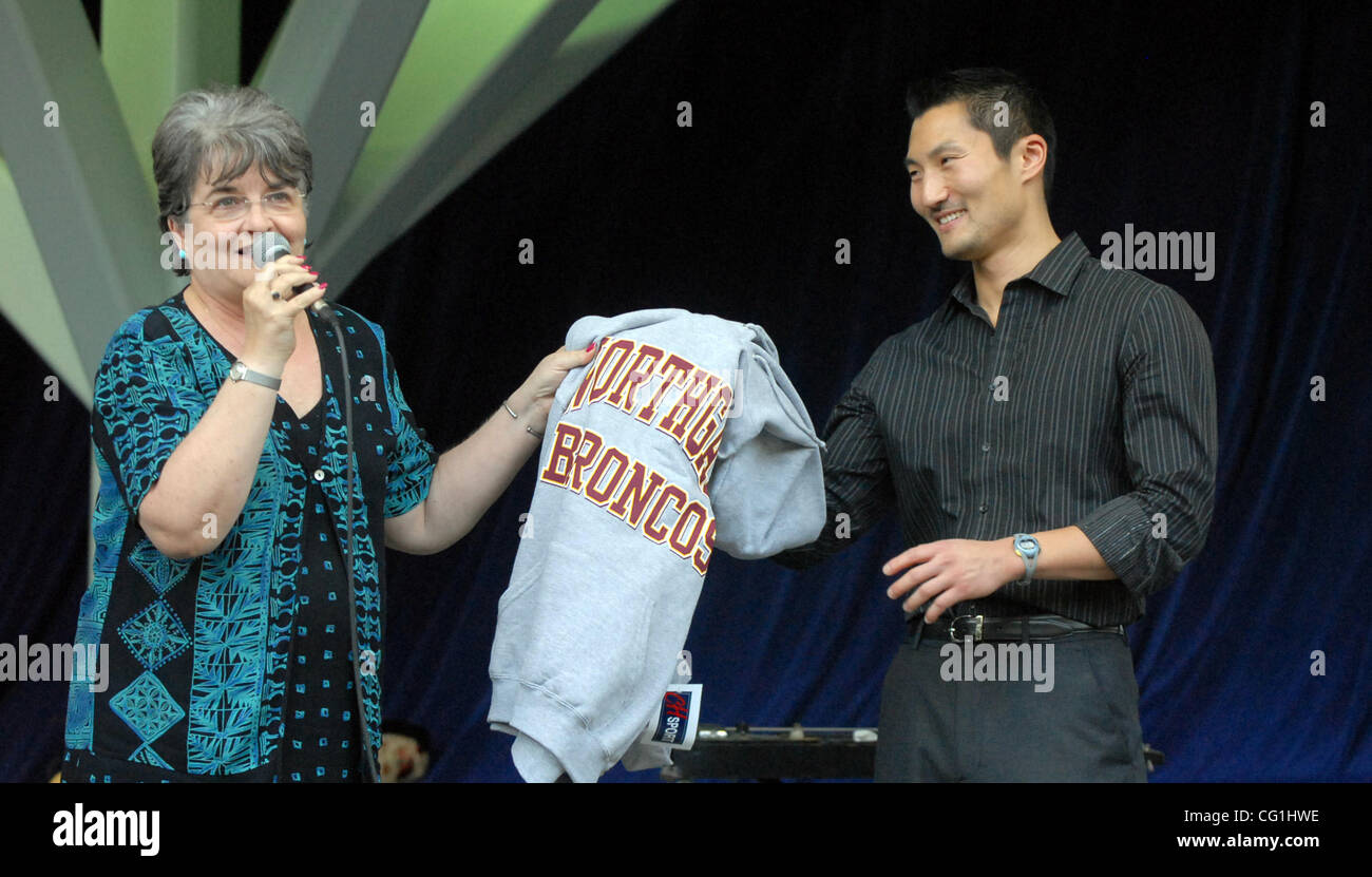 Northgate High principal Martha Riley presents a school sweatshirt to ...