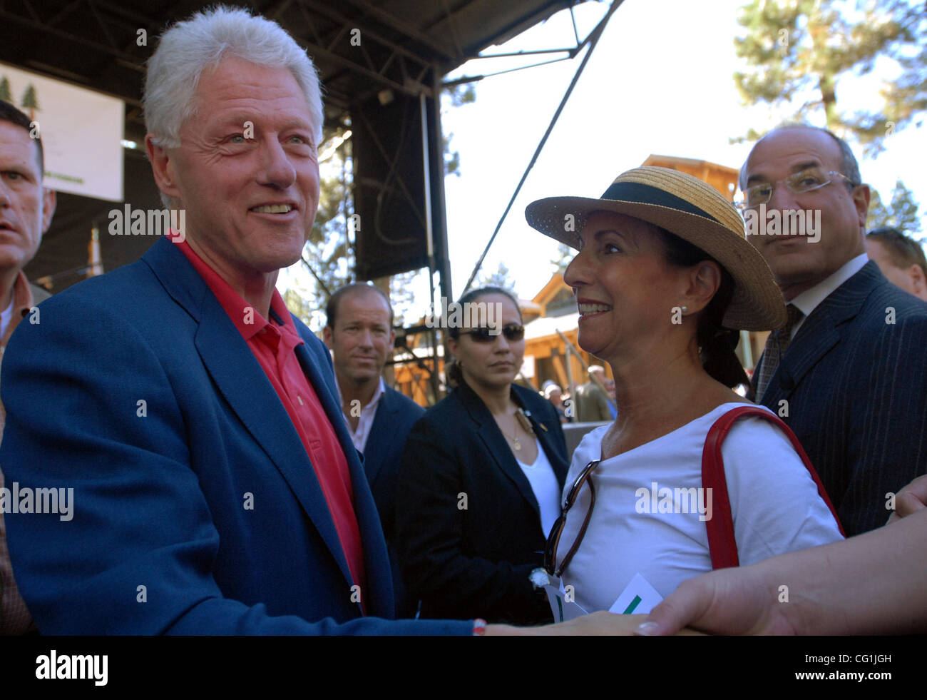 Former President Bill Clinton shakes hands with the crowd after ...