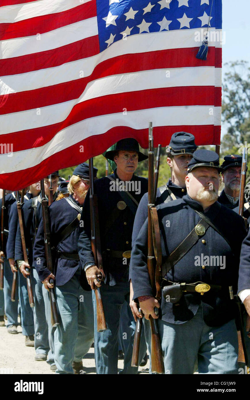 Union Army Civil War re-enactors march towards the battlefield during ...