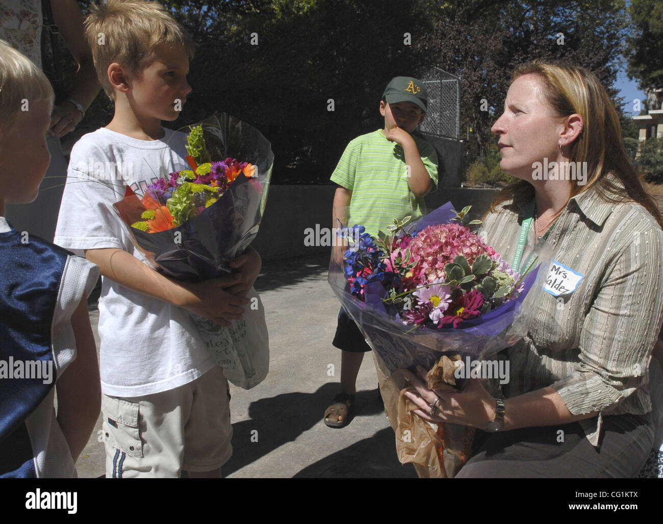New Beach Elementary School Principal Julie Valdez chats with, from ...