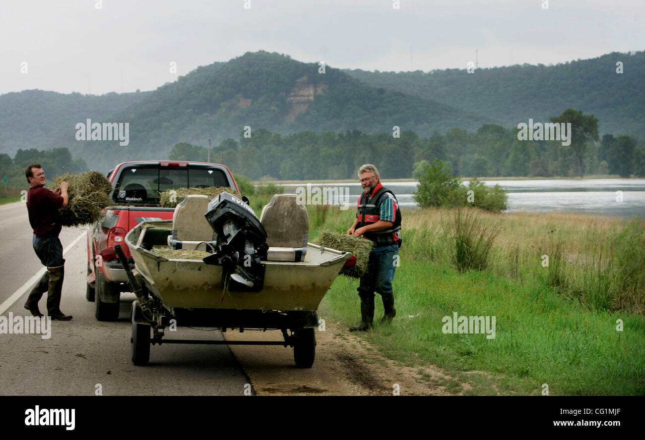 August 21st, 2007 - Hokah, MN, USA - Beef farmer Jerrry Welke, right ...